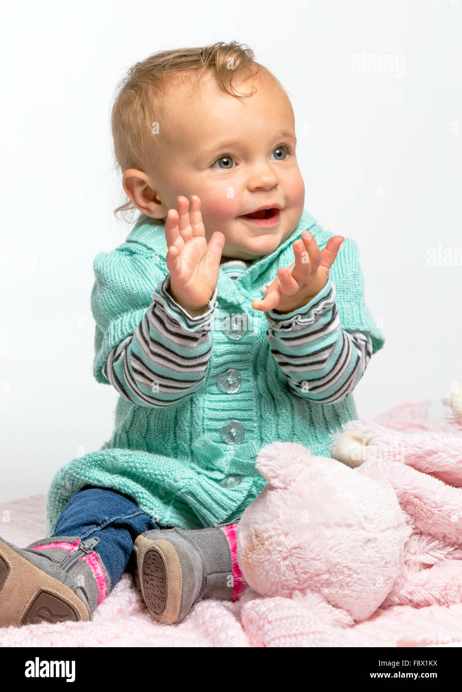 Studio photograph of cute smiling one year old baby girl Stock Photo ...