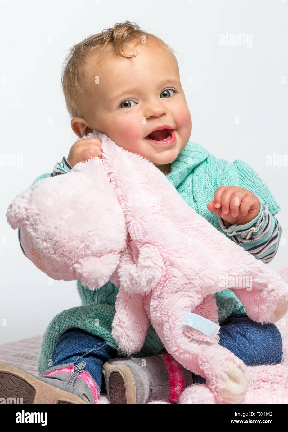 Studio photograph of cute smiling one year old baby girl Stock Photo ...