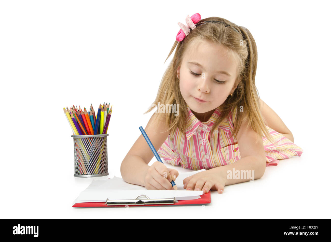 Little girl writing with pencils Stock Photo - Alamy