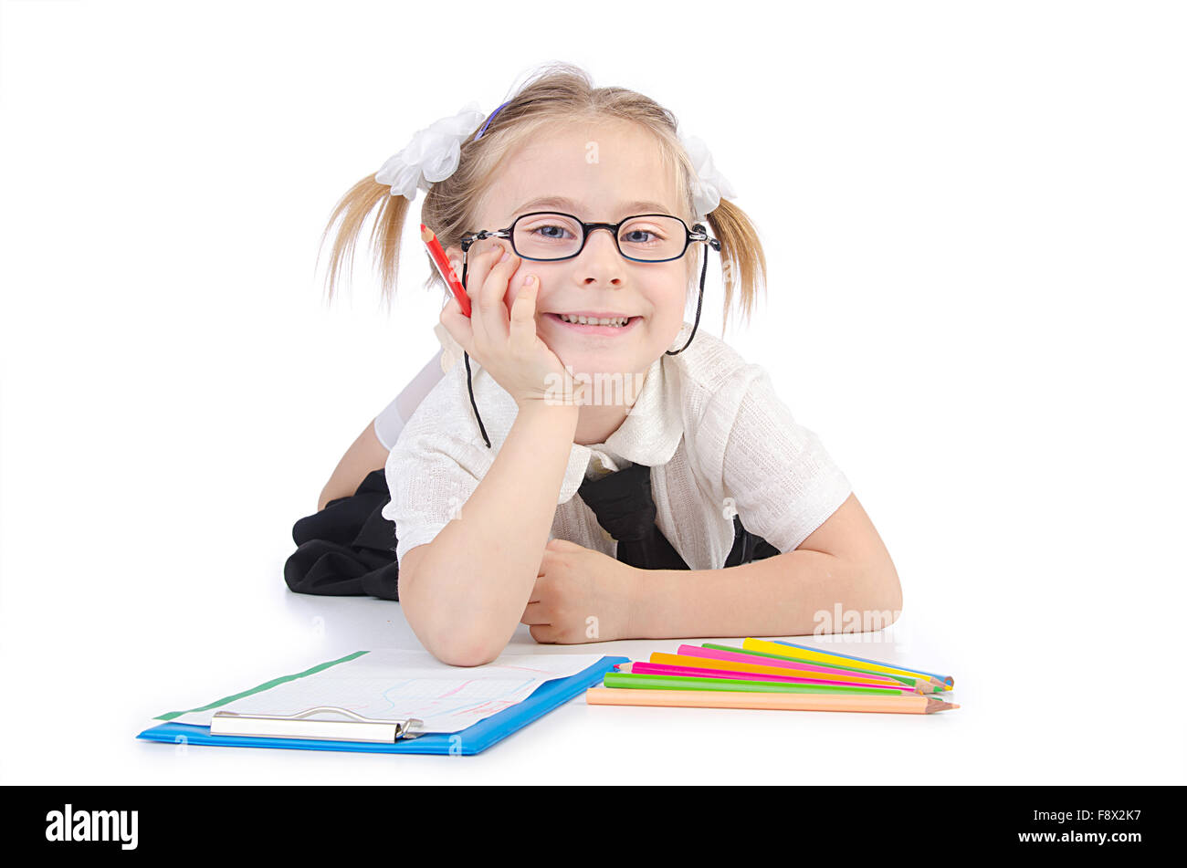 Little girl writing with pencils Stock Photo - Alamy
