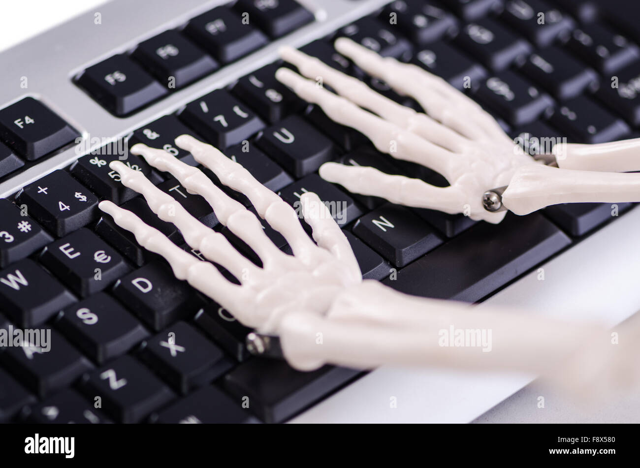 Skeleton working on laptop hi-res stock photography and images - Alamy