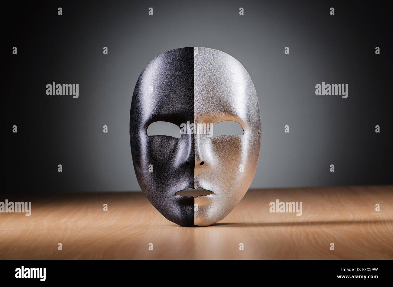 Mask against the dark background Stock Photo - Alamy