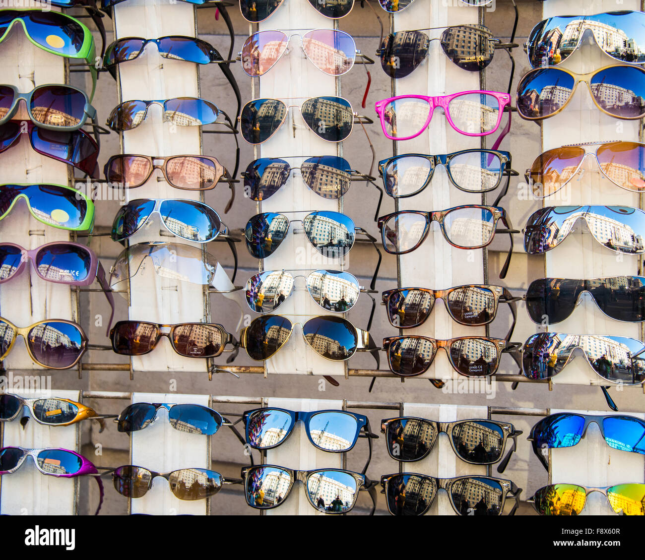 Many sunglasses on display in shop Stock Photo - Alamy