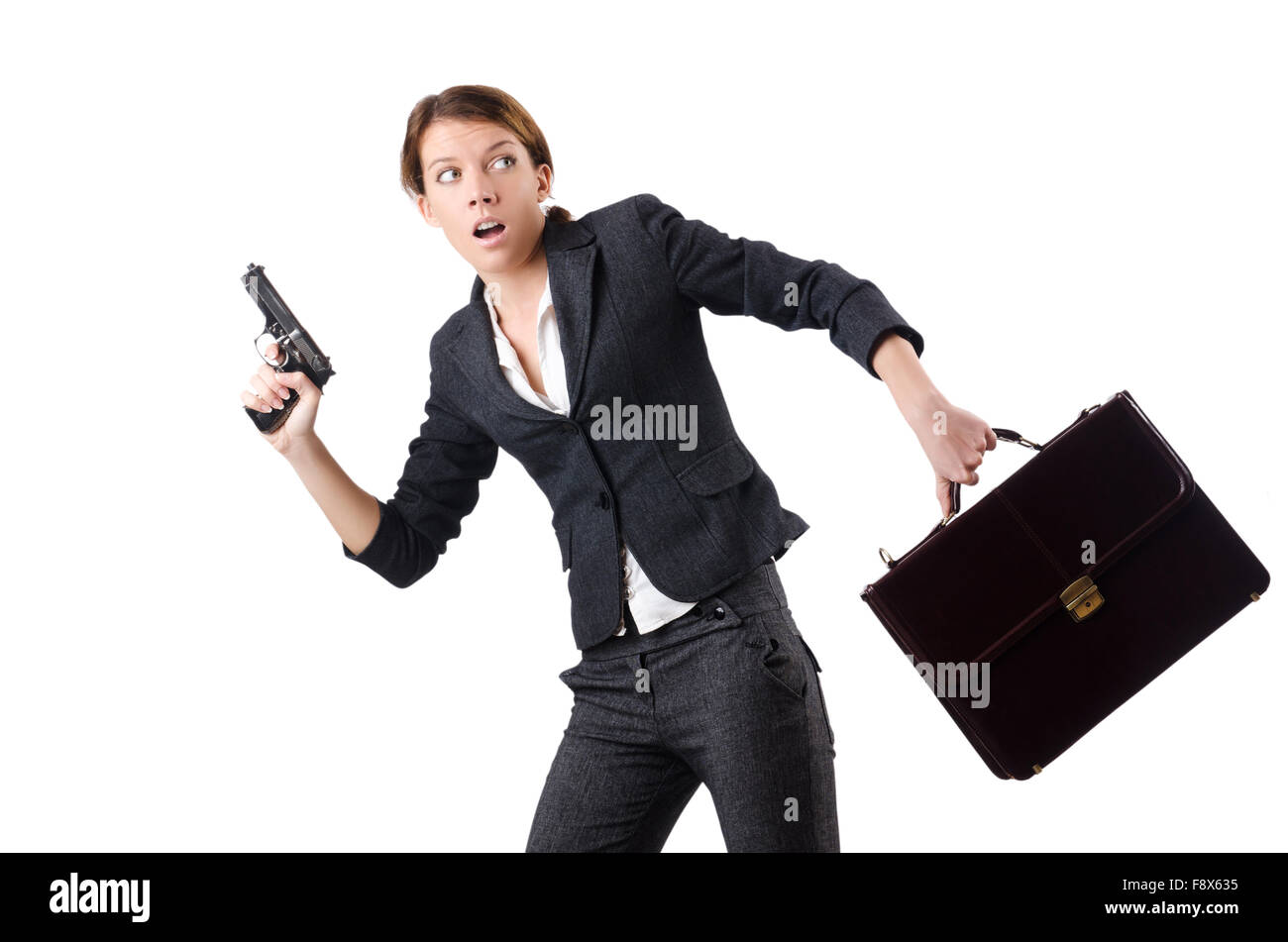 Woman businewoman with hand gun Stock Photo - Alamy