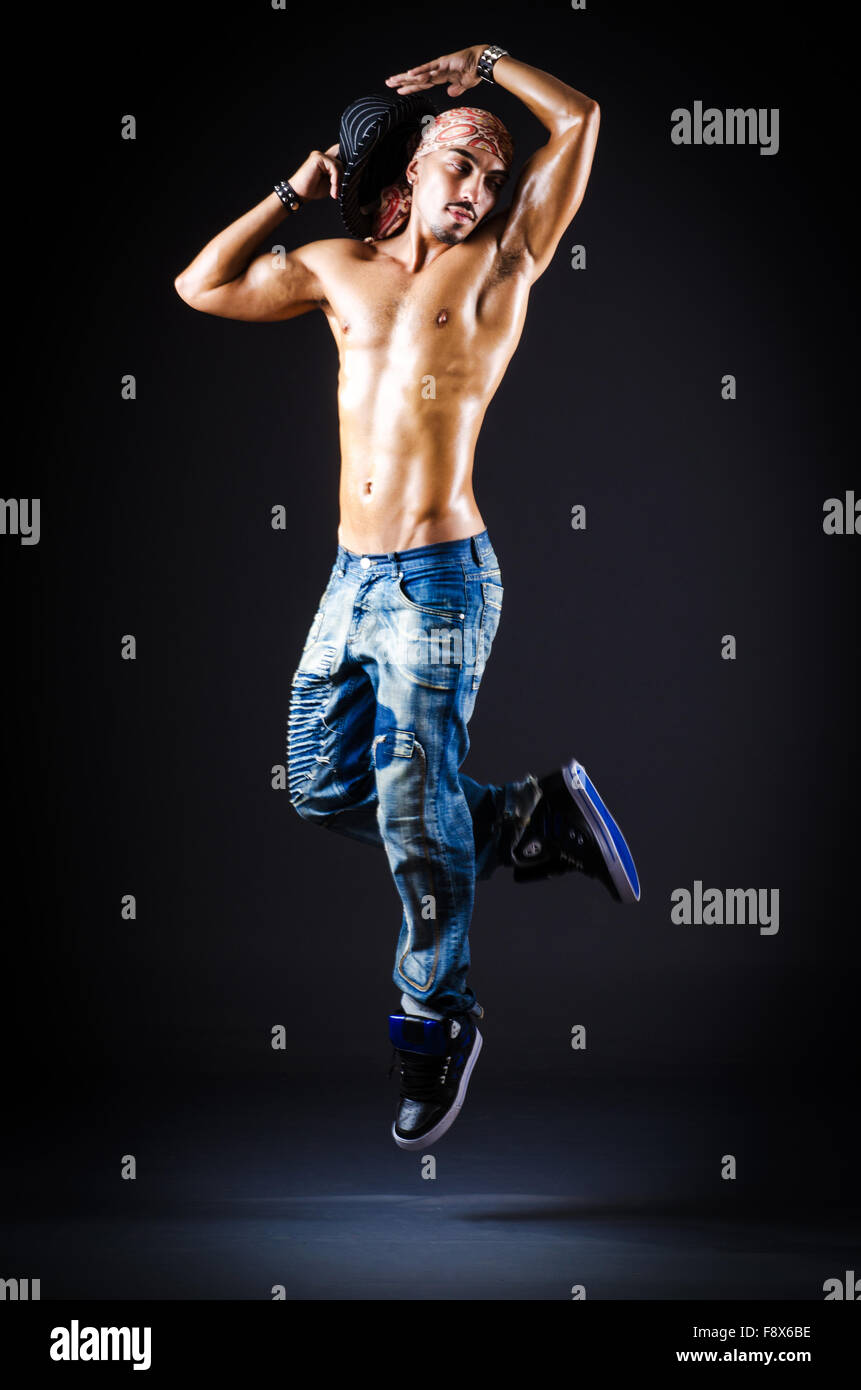 Dancer dancing in dark room Stock Photo - Alamy