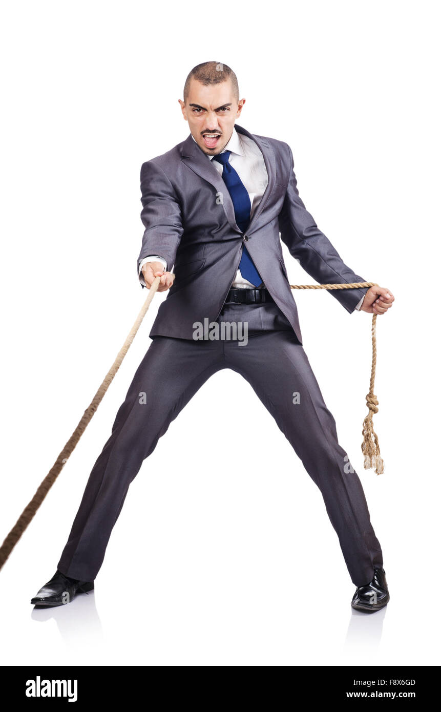 Man pulling the rope on white Stock Photo - Alamy