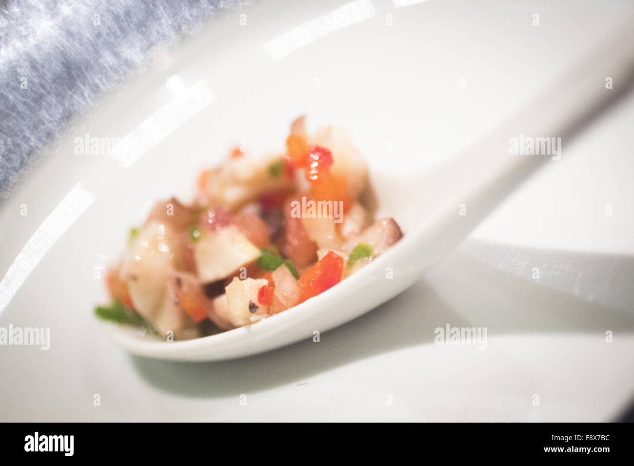 Dish of starter vegetable and seafood on plate in restaurant on table ...