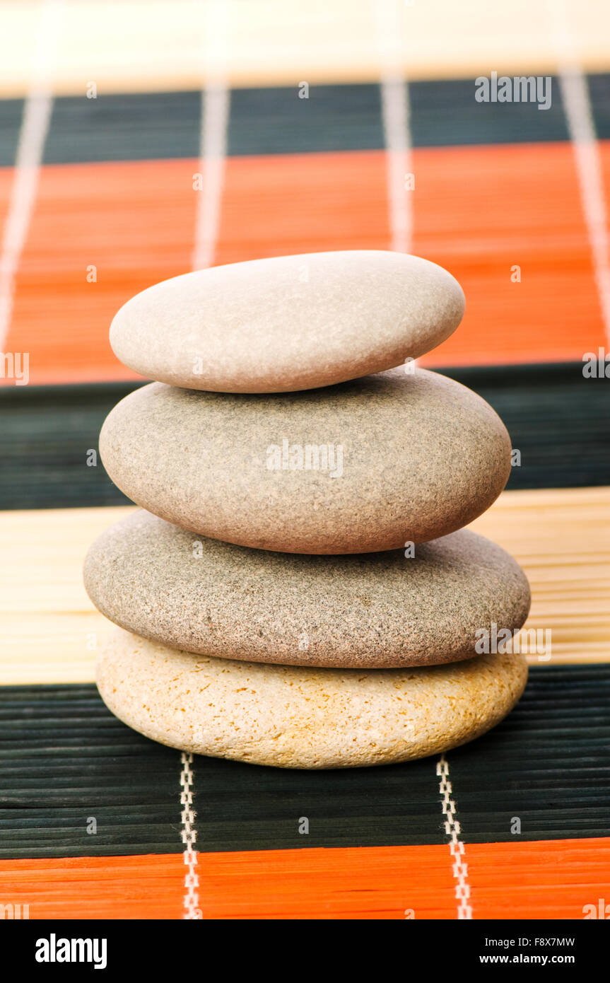 Stack of spa pebbles isolated on white Stock Photo - Alamy