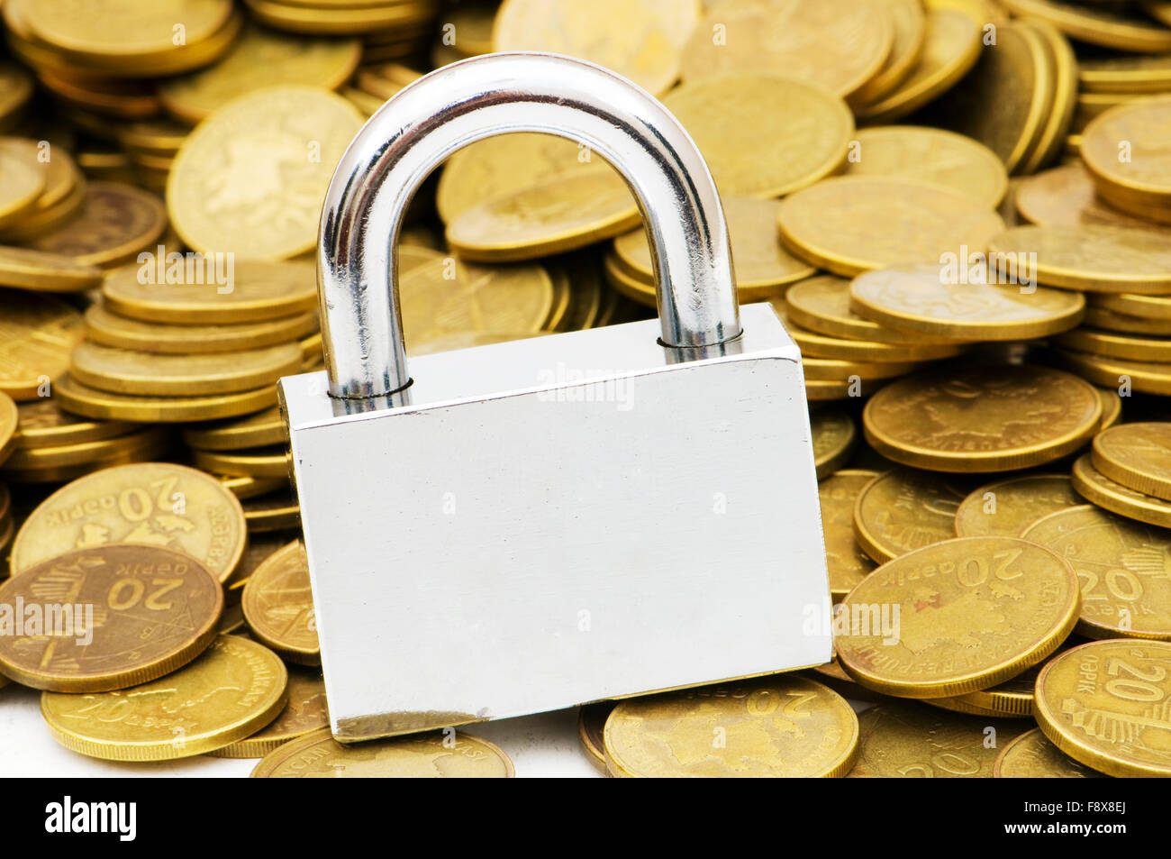 Concept of financial security with lock and coins Stock Photo - Alamy