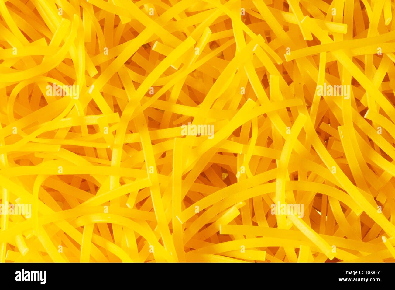 Extreme close up of yellow italian pasta Stock Photo - Alamy