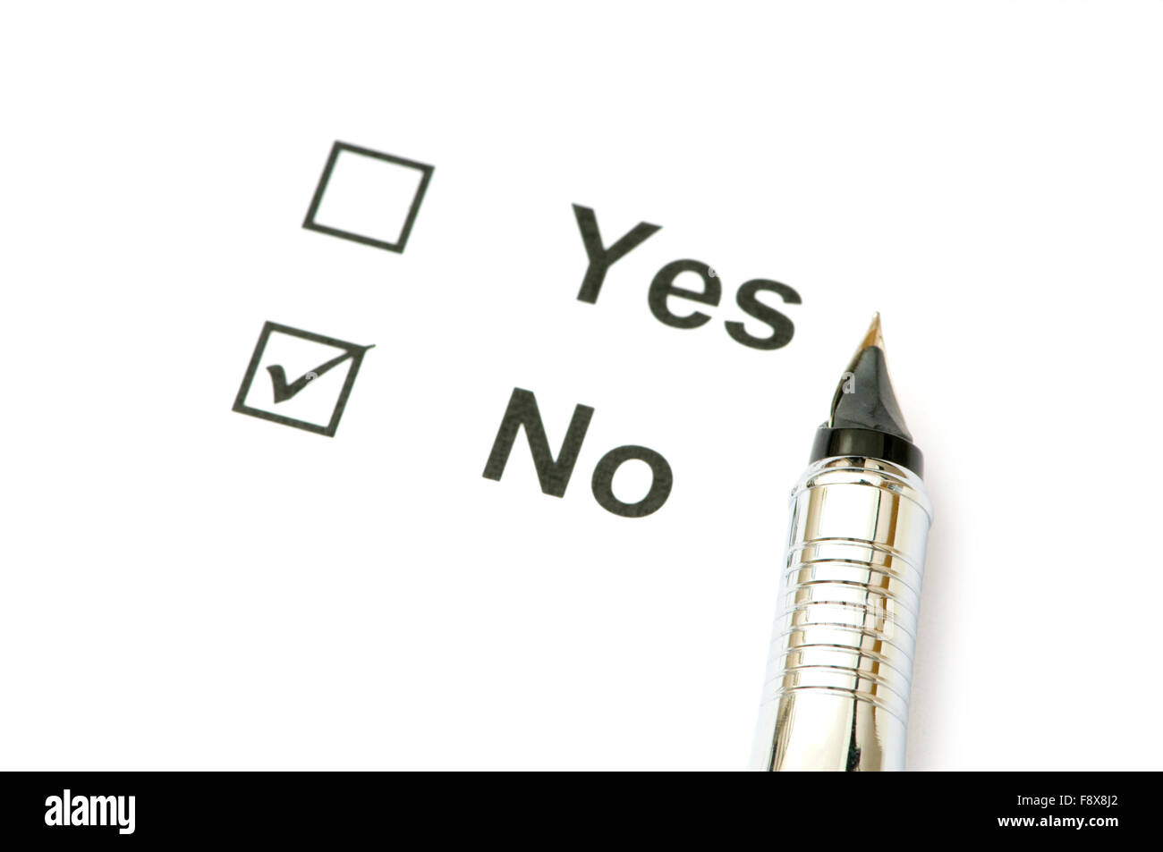 Pen and tick boxes - focus on the pen Stock Photo - Alamy