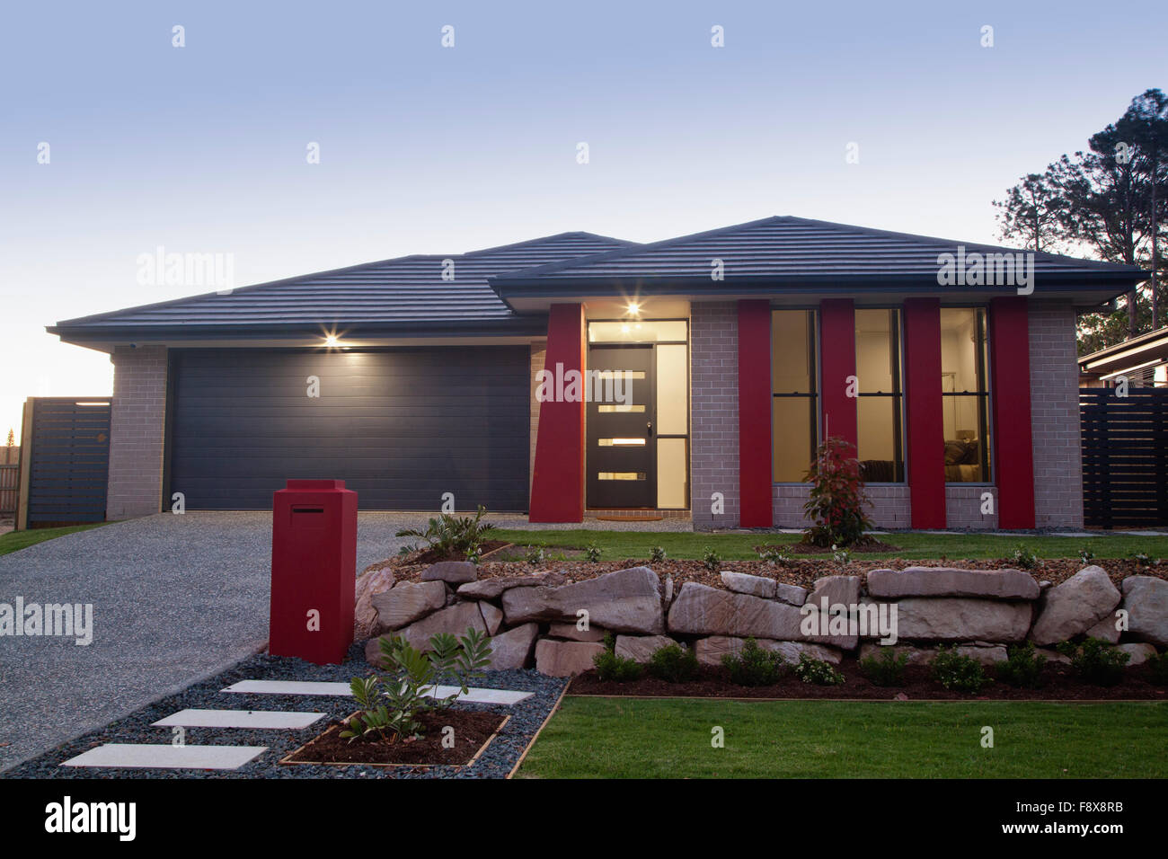 Stylish suburban house front at dusk Stock Photo - Alamy