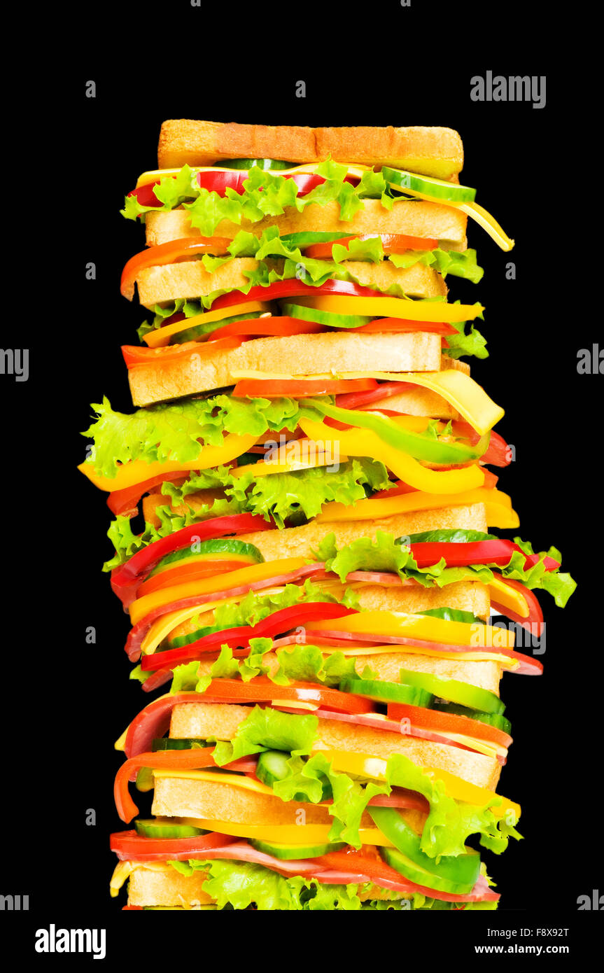 Tall sandwich isolated on the black background Stock Photo - Alamy