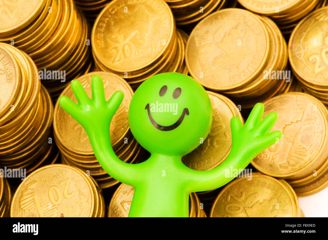 Smiley and coins isolated on the white Stock Photo - Alamy