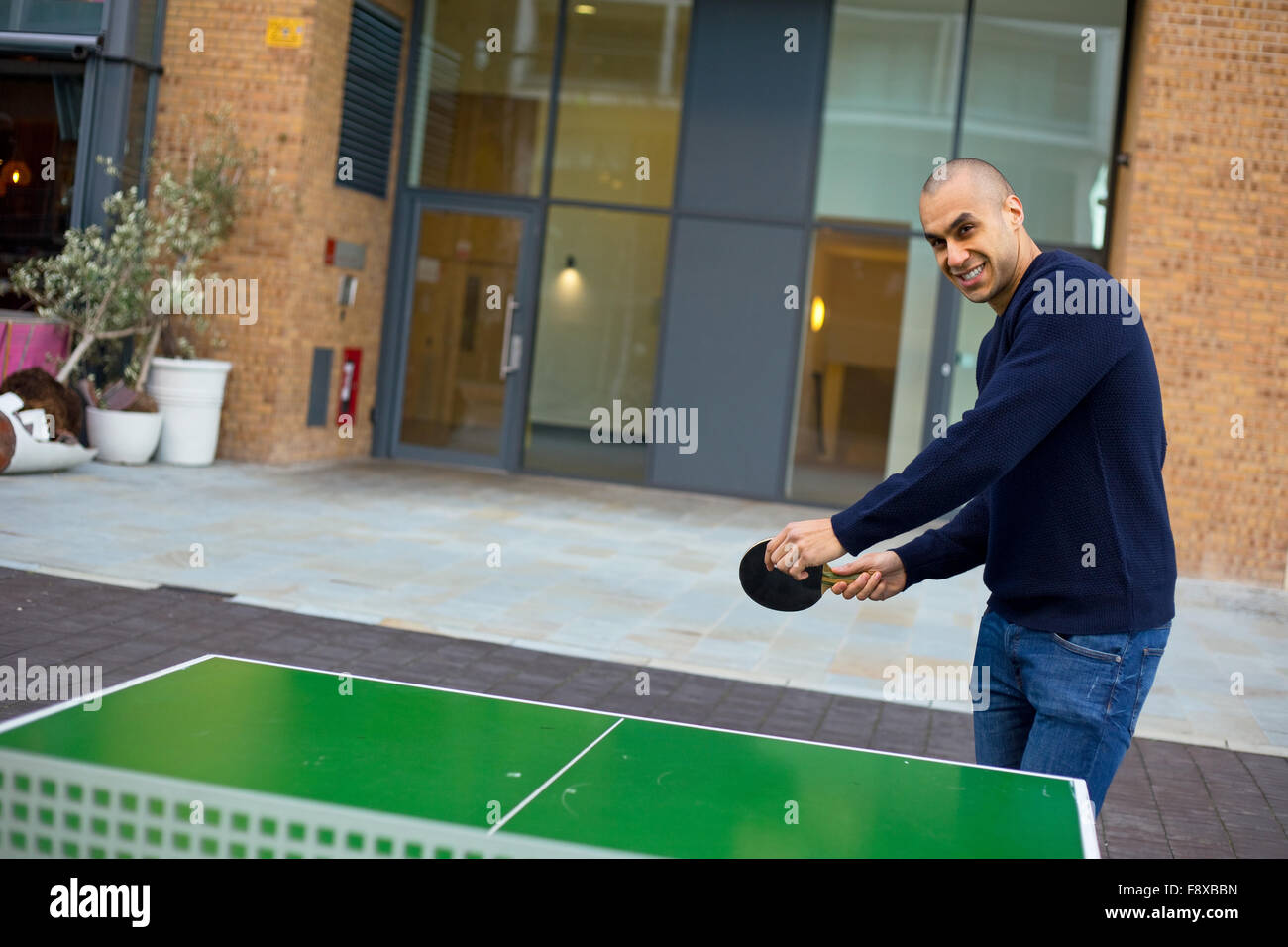 young man playing table tennis Stock Photo - Alamy