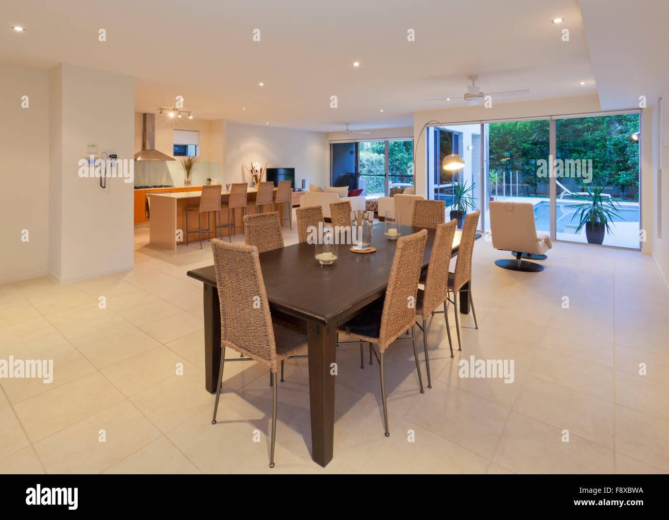 Wooden dining table and kitchen in a modern house overlooking the ...