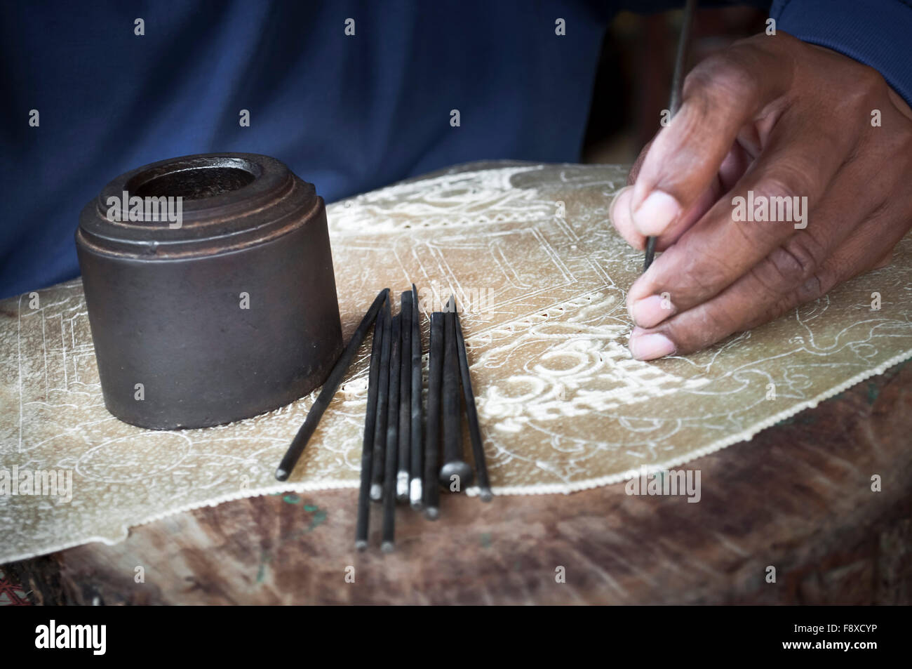 Traditional craftsman carving wood Stock Photo - Alamy