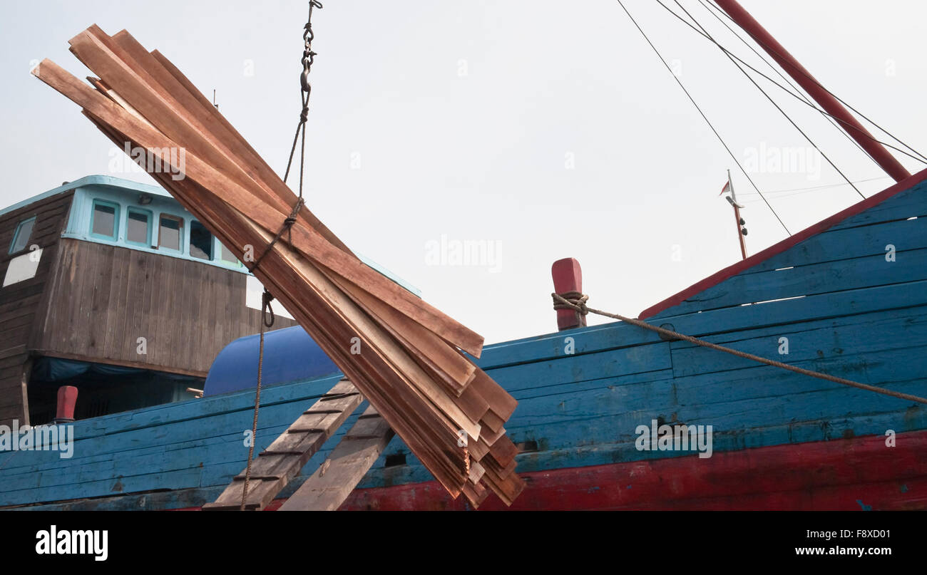 Cargo ship loading goods Stock Photo - Alamy
