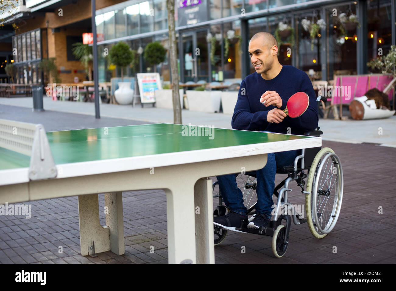 disabled man enjoying a game of ping pong in his wheelchair Stock Photo ...
