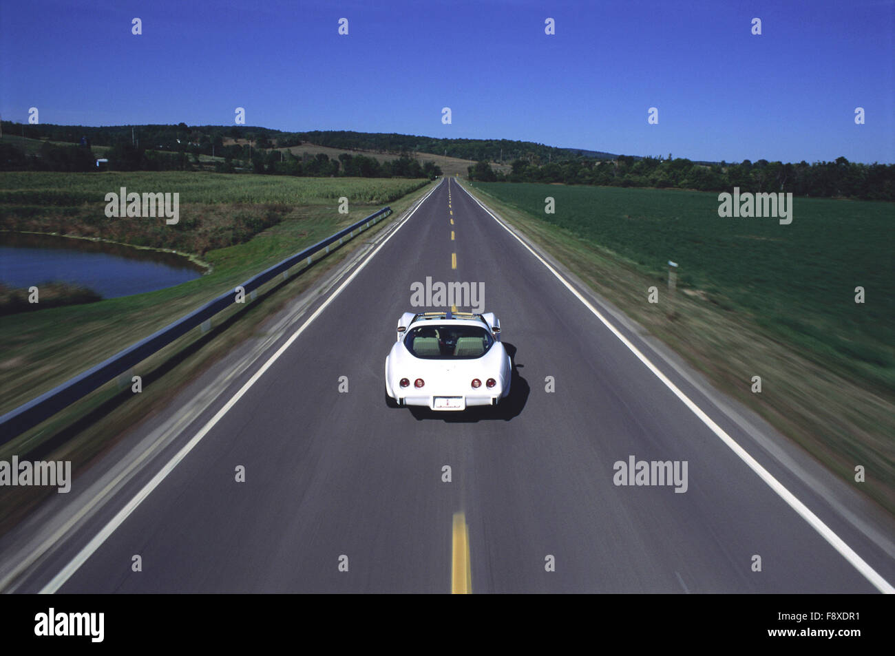 Carefree Convertible Driving Down Open Road Stock Photo - Alamy