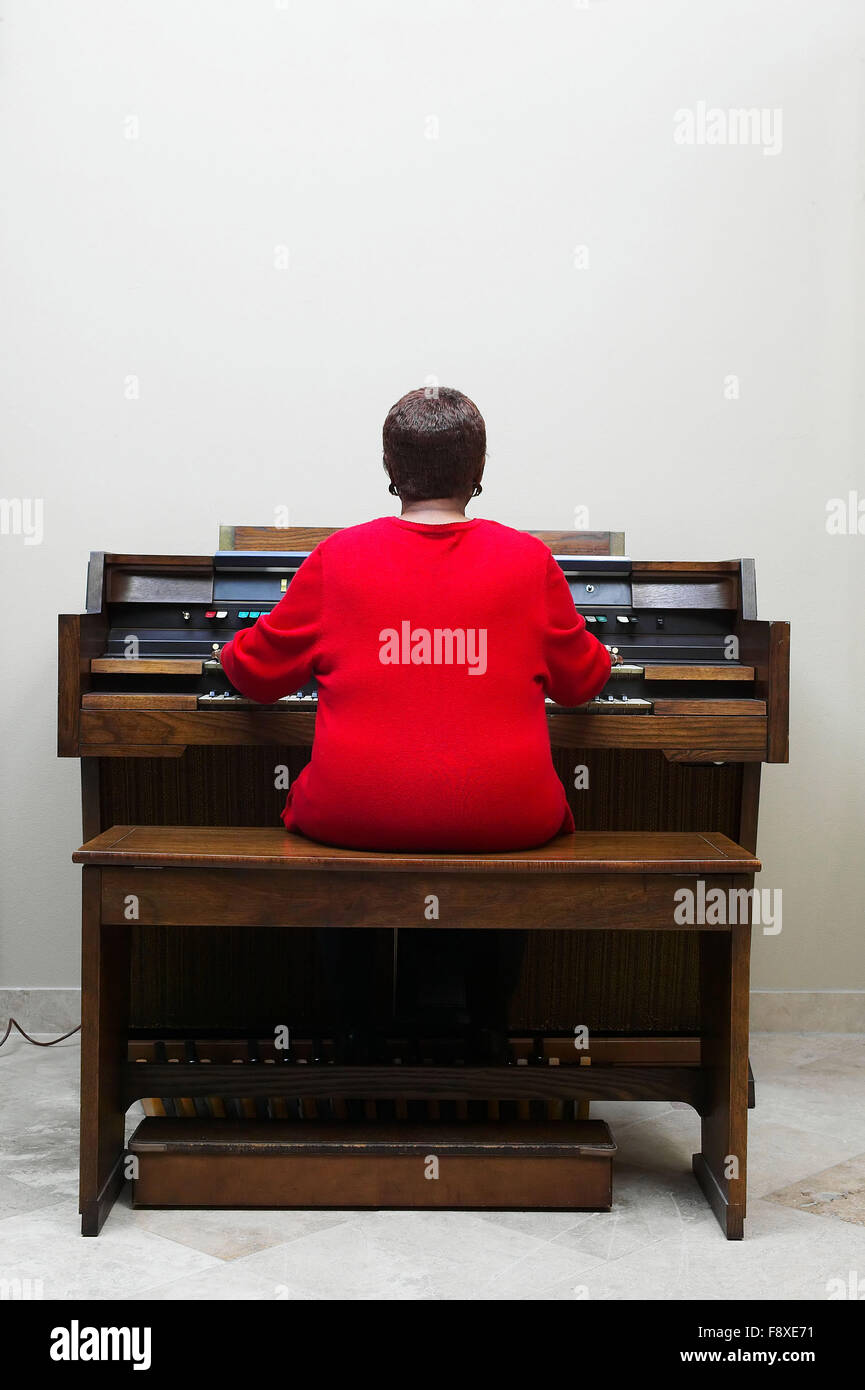 Woman playing organ hi-res stock photography and images - Alamy