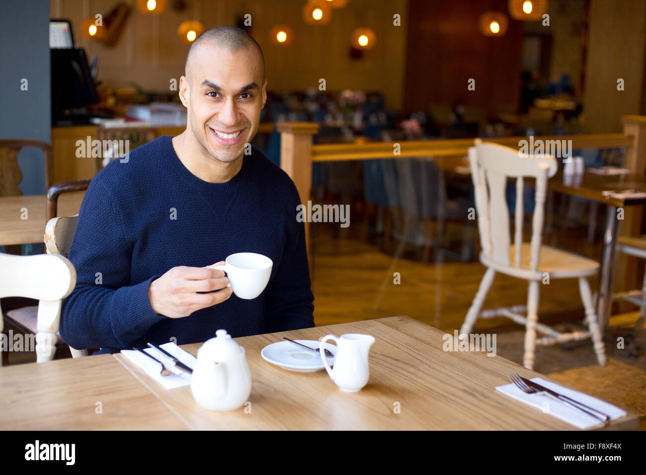 Young male drinking tea hi-res stock photography and images - Alamy