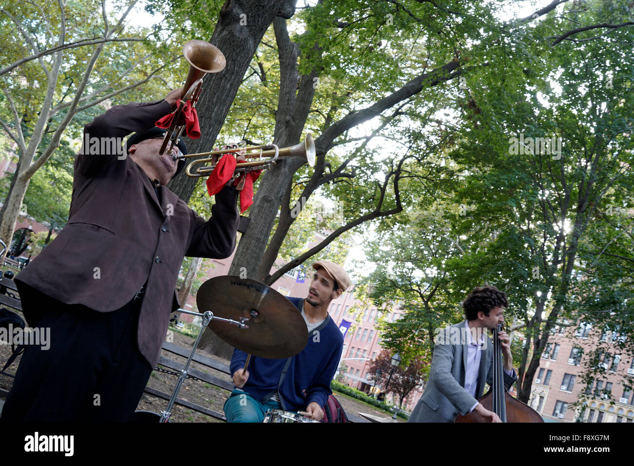 A musician playing two trumpets at same time during a performance in ...