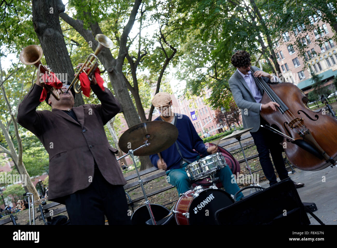 A musician playing two trumpets at same time during a performance in ...
