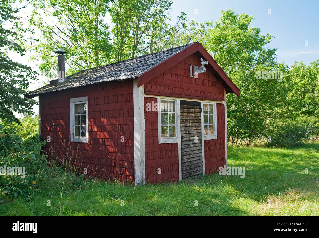 Brown wooden cabin in a forest Stock Photo - Alamy