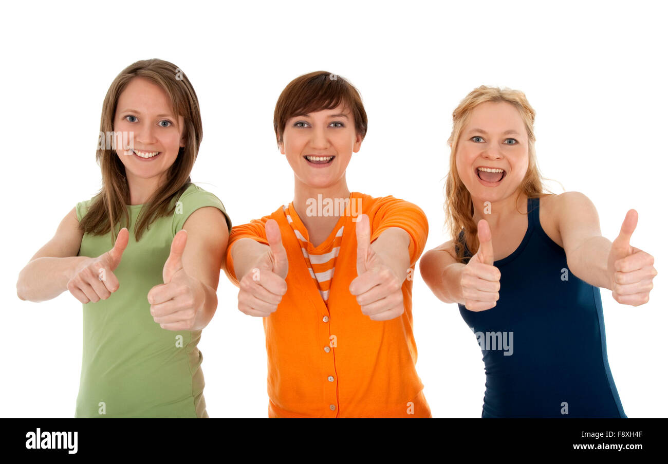 Three happy young women giving thumbs up Stock Photo - Alamy