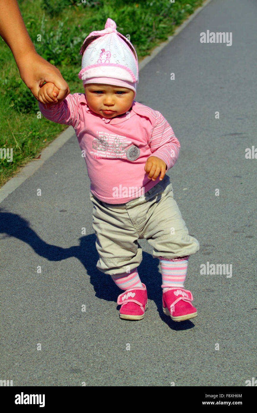 baby girl first steps Stock Photo - Alamy