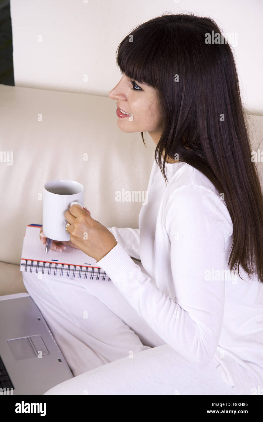 Drinking tea and working Stock Photo - Alamy