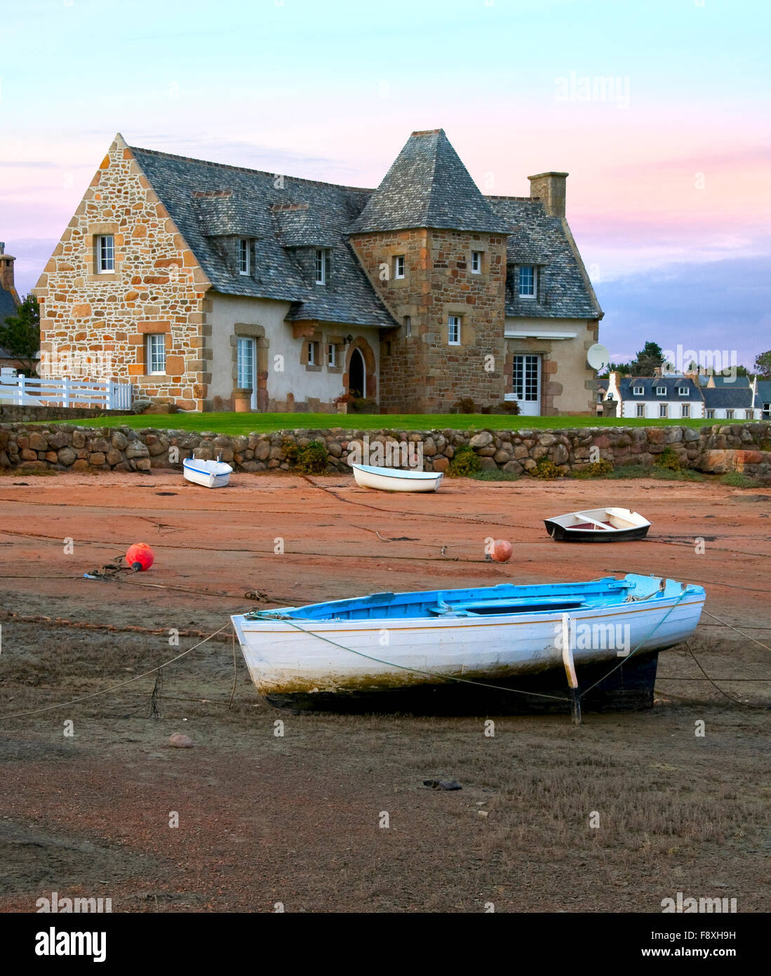 Ancient house and boats on a mooring - beautiful scenery at sunset ...