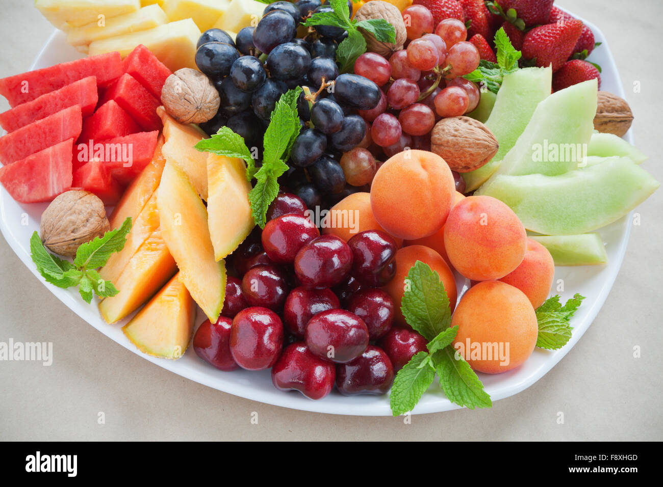 Colorful summer fruit platter with pineapple, watermelon, cherries ...