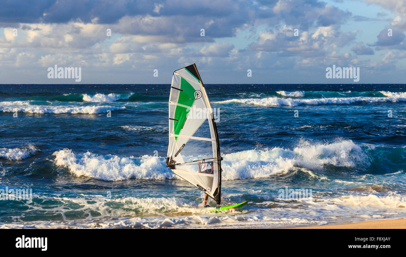 Windsurfer approaches Hookipa Beach on Maui at sunset Stock Photo - Alamy