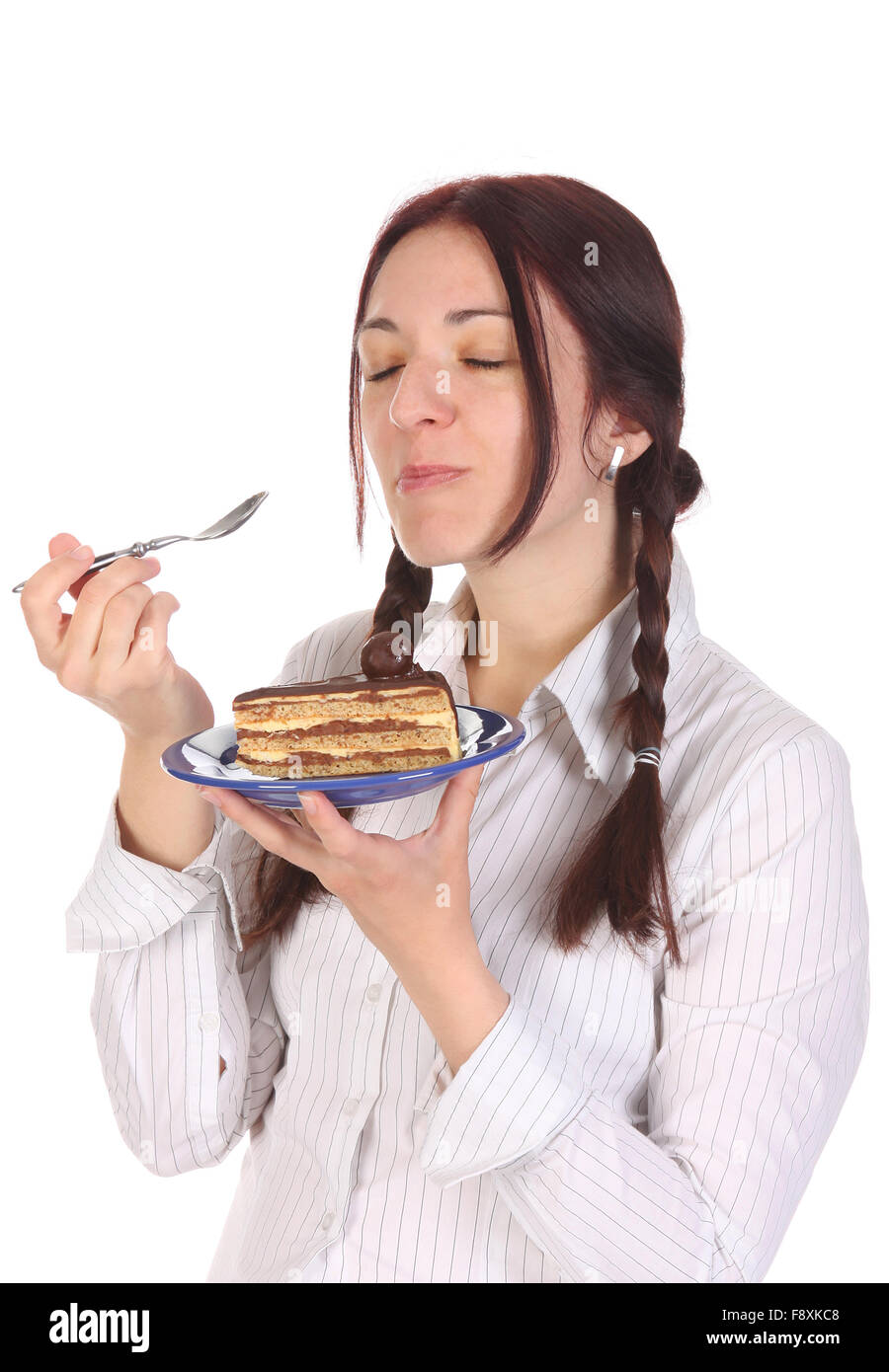 Beautiful woman eating piece of cake Stock Photo - Alamy