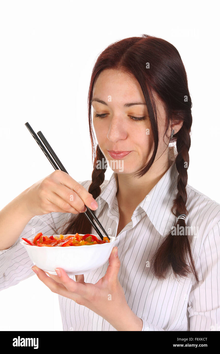 Beautiful woman eating with chopsticks Stock Photo - Alamy
