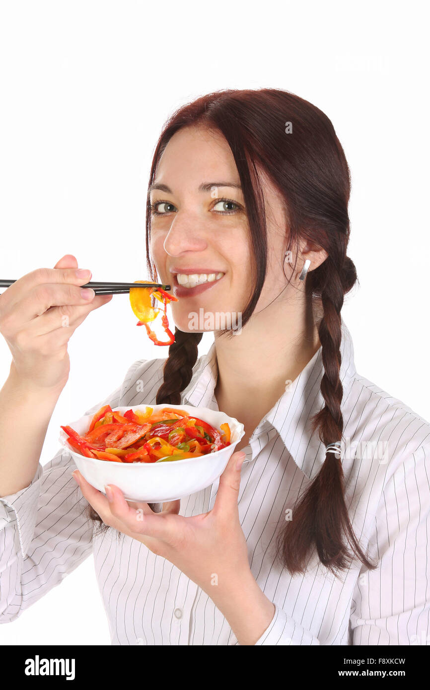 Beautiful woman eating with chopsticks Stock Photo - Alamy