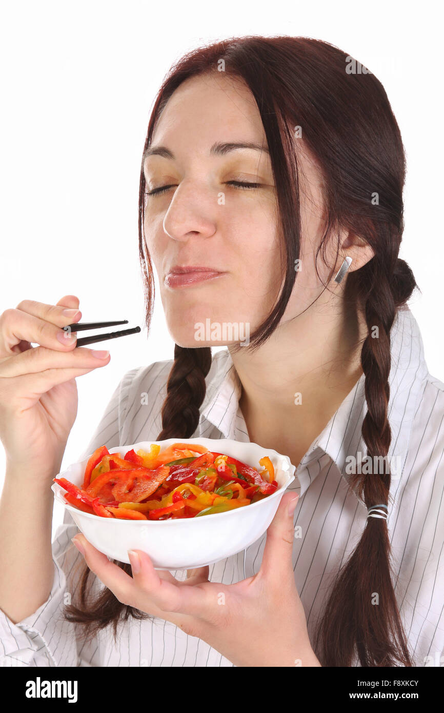 Beautiful woman eating with chopsticks Stock Photo - Alamy