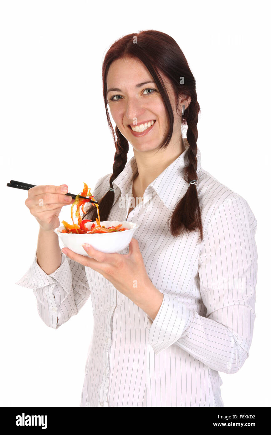 Beautiful woman eating with chopsticks Stock Photo - Alamy