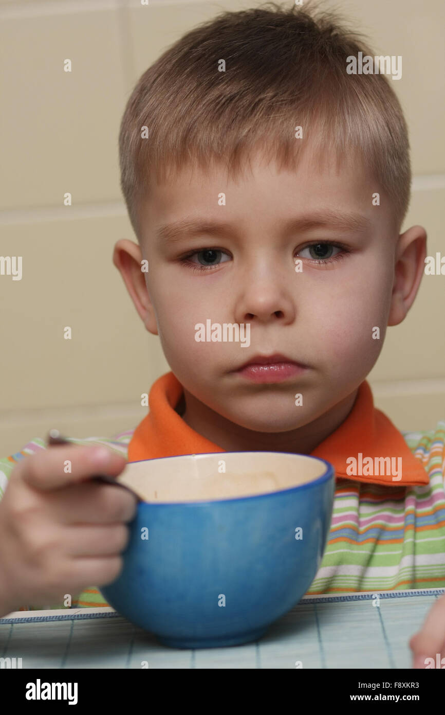 little boy at the dinner table Stock Photo - Alamy
