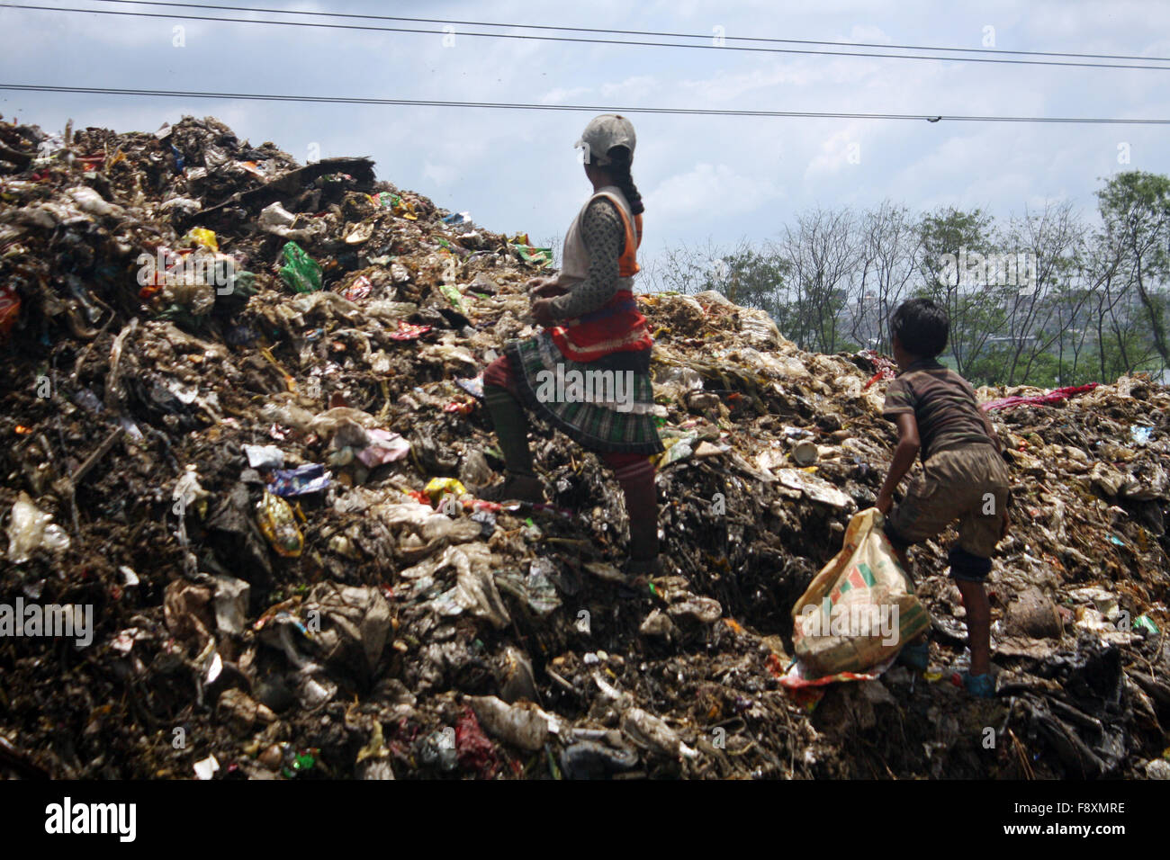 Child waste pickers pick the non- biodegradable waste to be used for ...