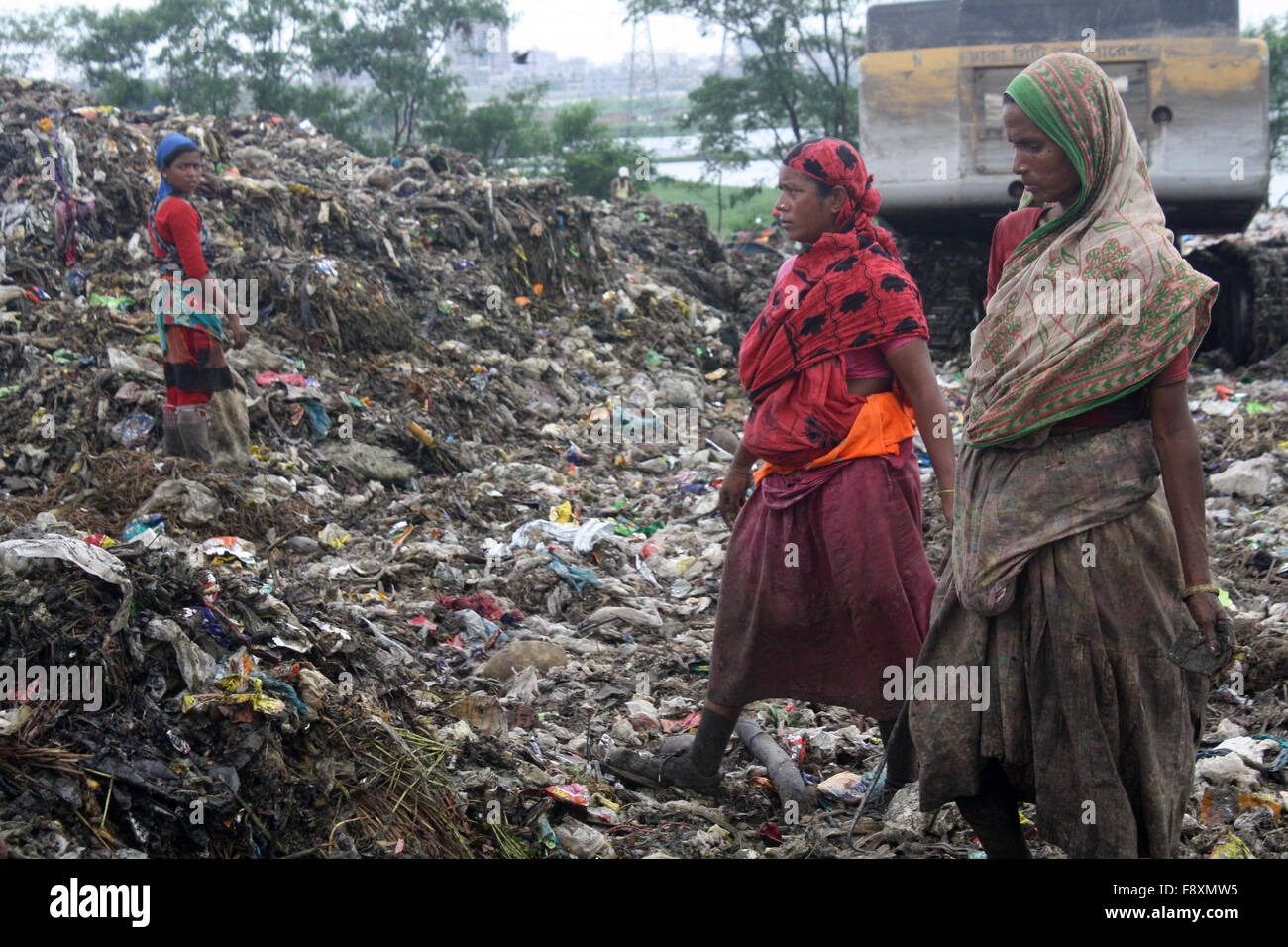 Male and Female waste pickers pick the non- biodegradable waste to be ...