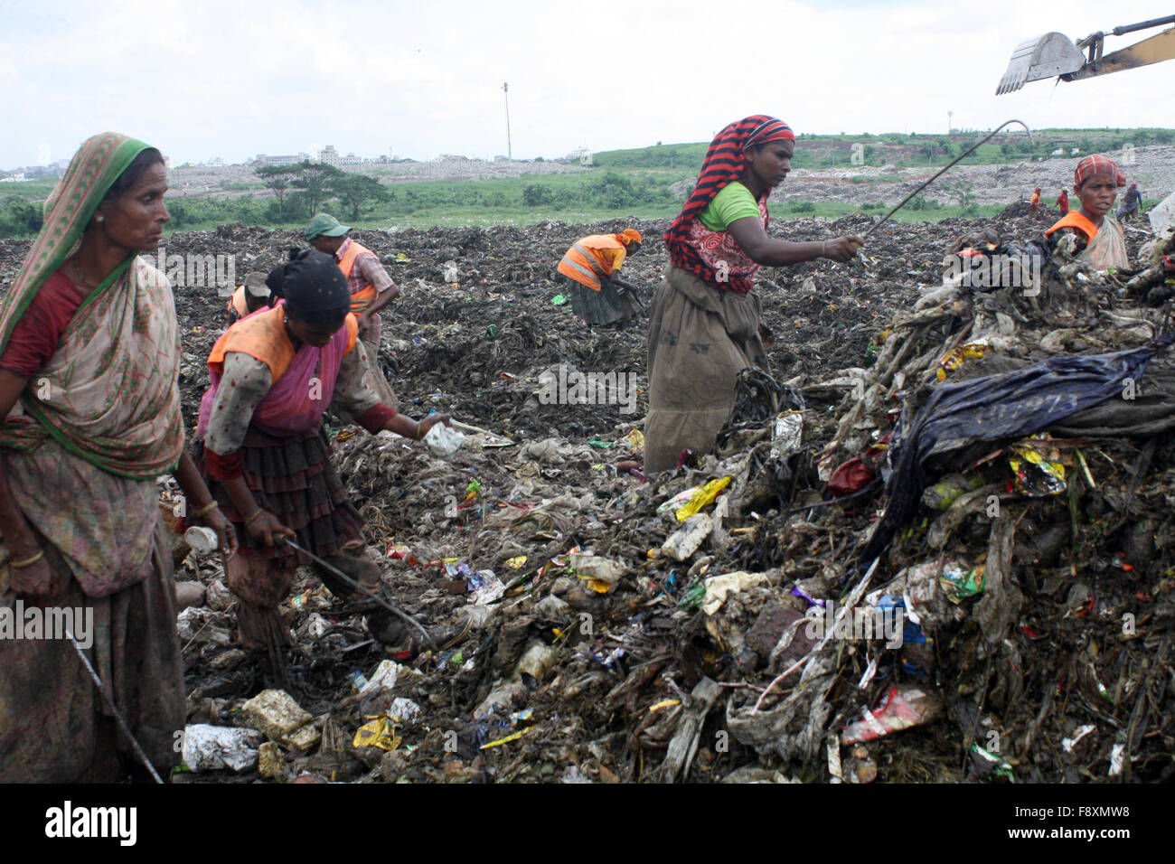 Male and Female waste pickers pick the non- biodegradable waste to be ...
