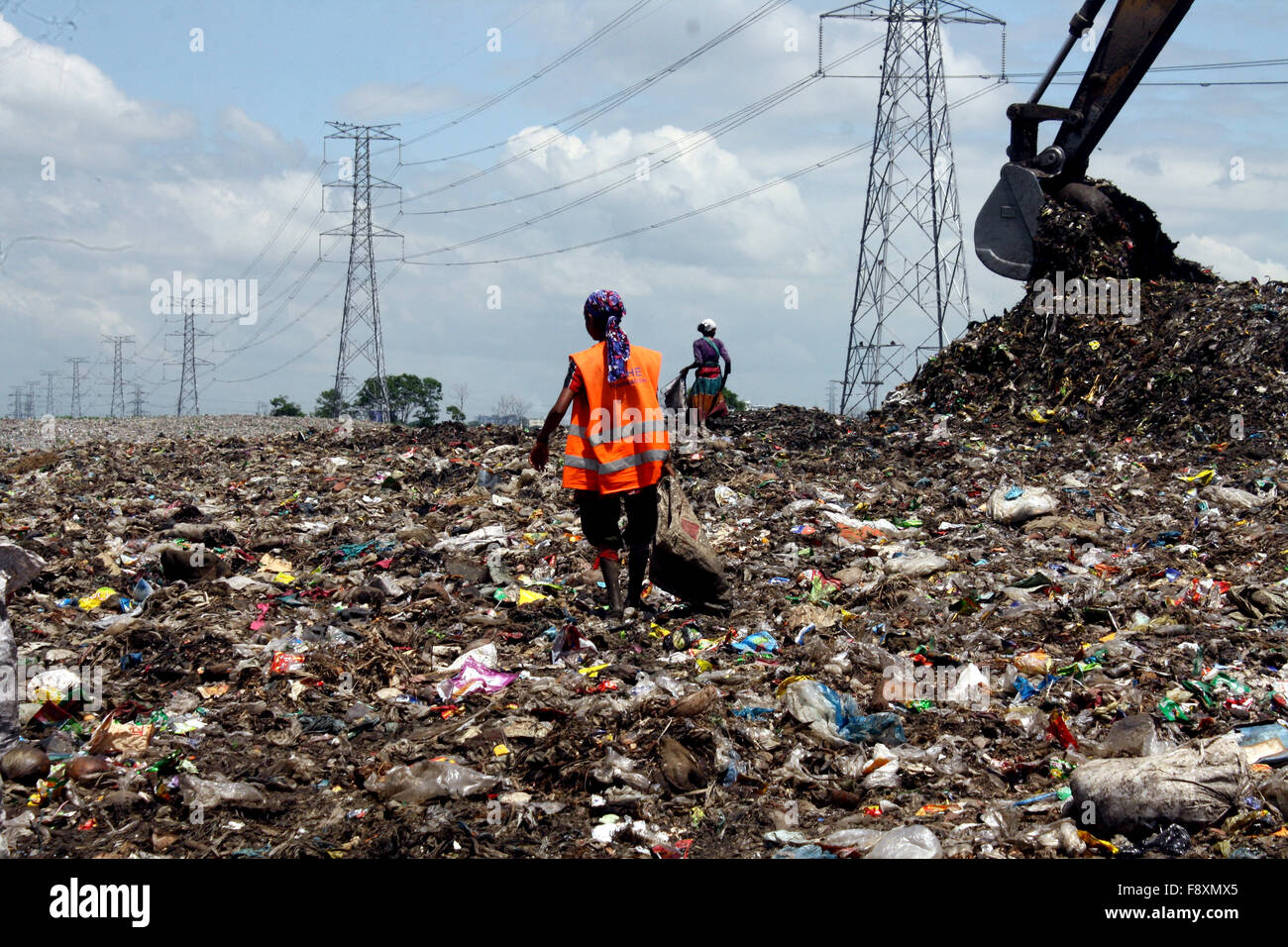 Male and Female waste pickers pick the non- biodegradable waste to be ...
