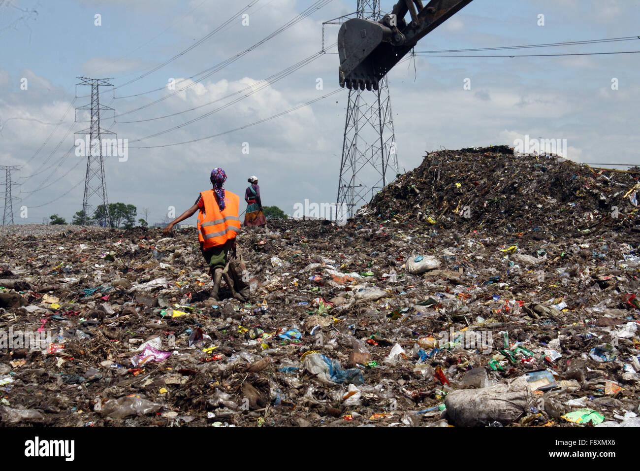 Male and Female waste pickers pick the non- biodegradable waste to be ...