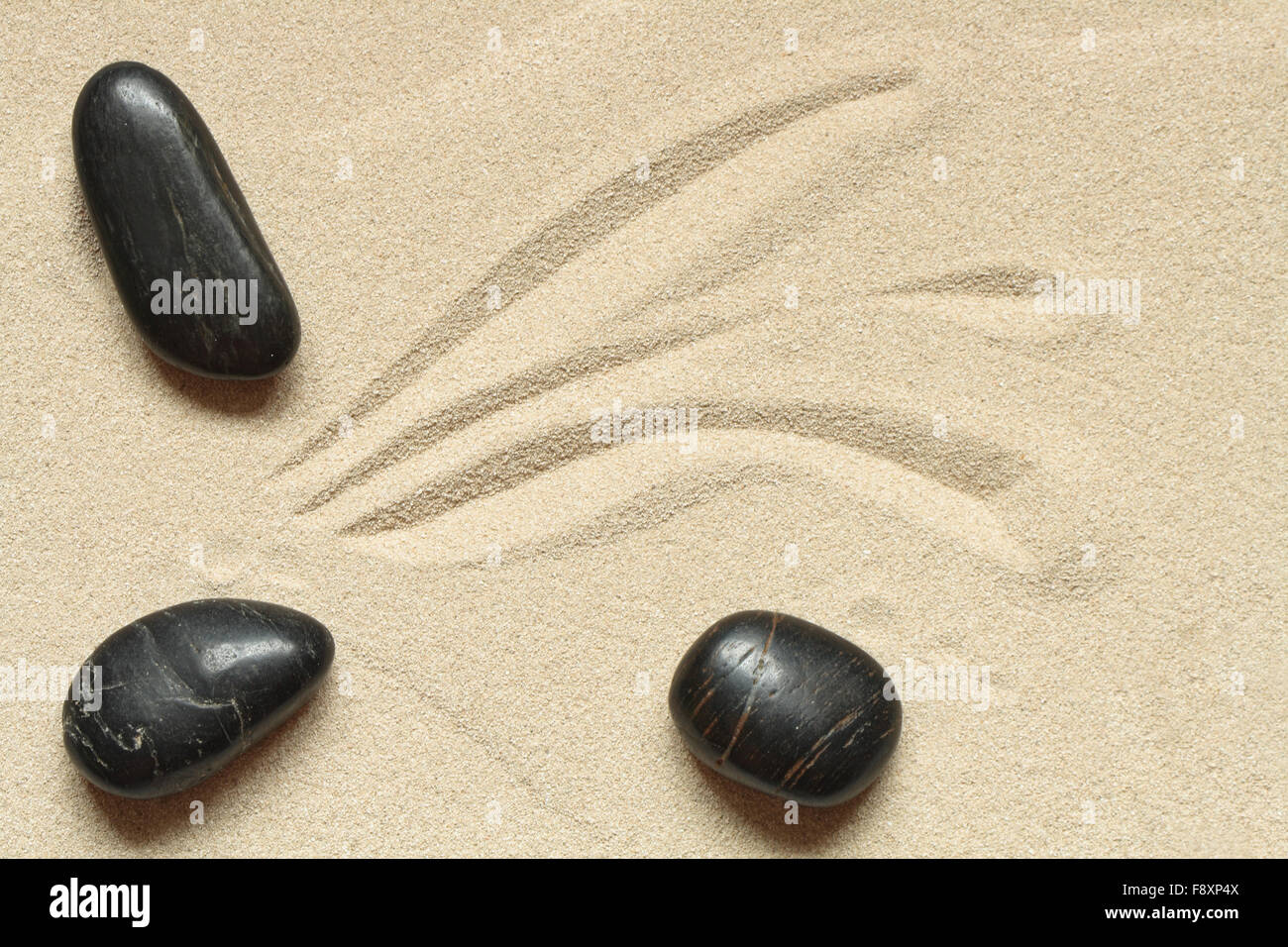 Stones On Sand Stock Photo - Alamy