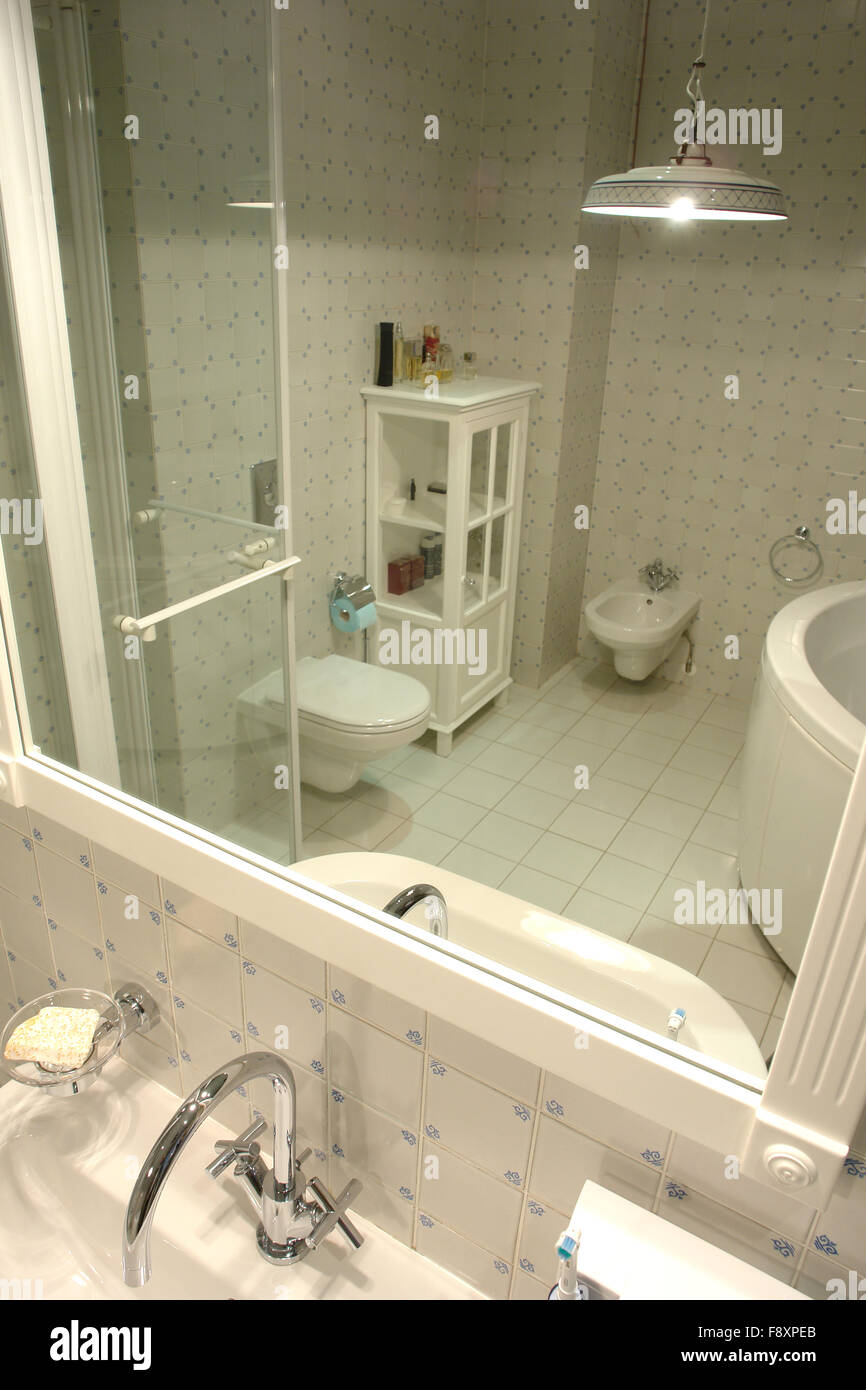 interior of bathroom reflected in the mirror Stock Photo - Alamy