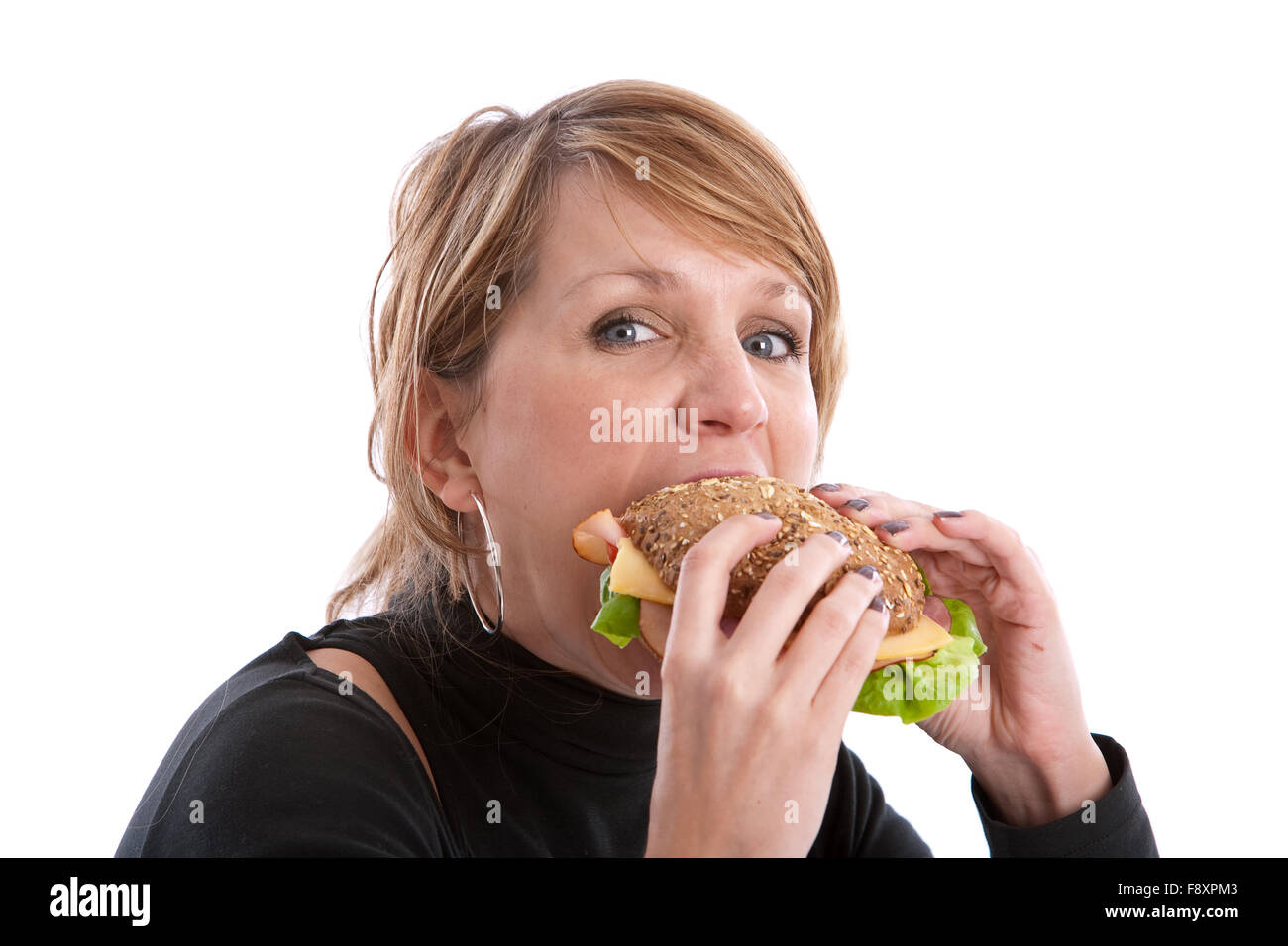 Taking a big bite Stock Photo - Alamy