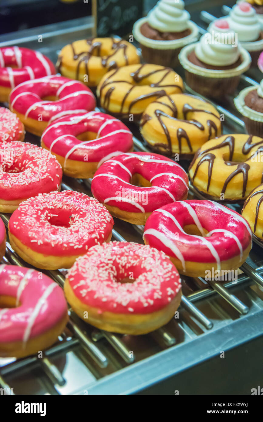 Sweet donuts arranged at display Stock Photo - Alamy